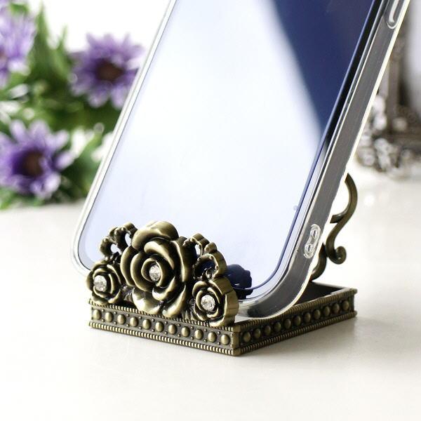 薔薇のレリーフにストーンをつけたエレガントなマルチスタンドホルダー部は曲線を活かしたクラシカルなシルエットで置いておくだけで気分が上がるような上品な輝きが美しいデザイン店頭のカウンターでカードを入れておいたりコースターやスマホを収納したりと...