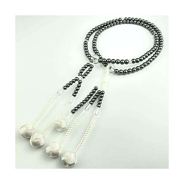 商品明細 主玉：6ミリブラックパール（ ABS樹脂製） 四天玉：４ミリ新水晶（プラスチック製） 親玉：１２ミリ新水晶（プラスチック製） 房の色：白色手毬房国際創価学会専門数珠です、男女通用のMサイズ ABS樹脂に特別なブラック塗装をほどこし...