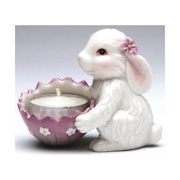 頭にお花を付けた可愛らしいうさちゃんが抱える卵の殻の器が、ティーライトホルダーになっています♪香りのティーライトホルダーを使用して、アロマキャンドルにもお勧めです。サイズ(cm)：　縦９．５X横９材質：　ポーセリン（陶磁器）