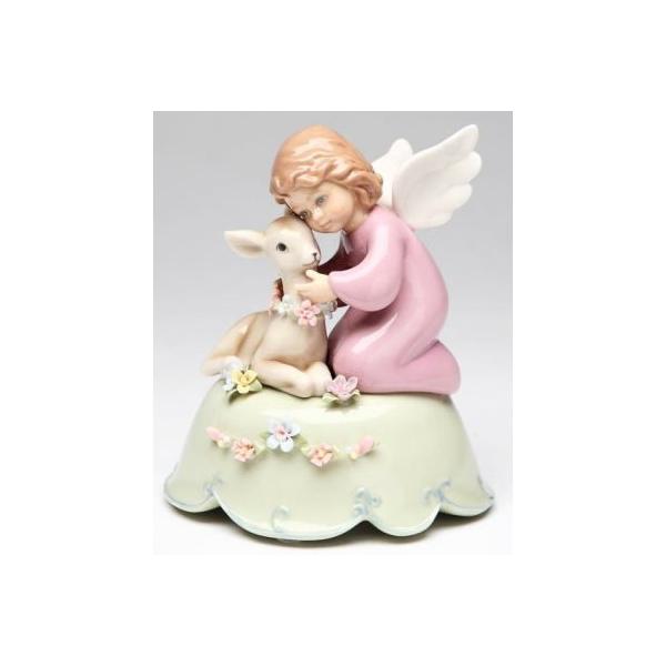 仲良く頬を寄せ合う、天使と小鹿のとても愛らしいオルゴールです♪サイズ(cm)：　縦１３X横１１．５材質：　陶磁器オルゴール曲：　"You've Got a Friend"