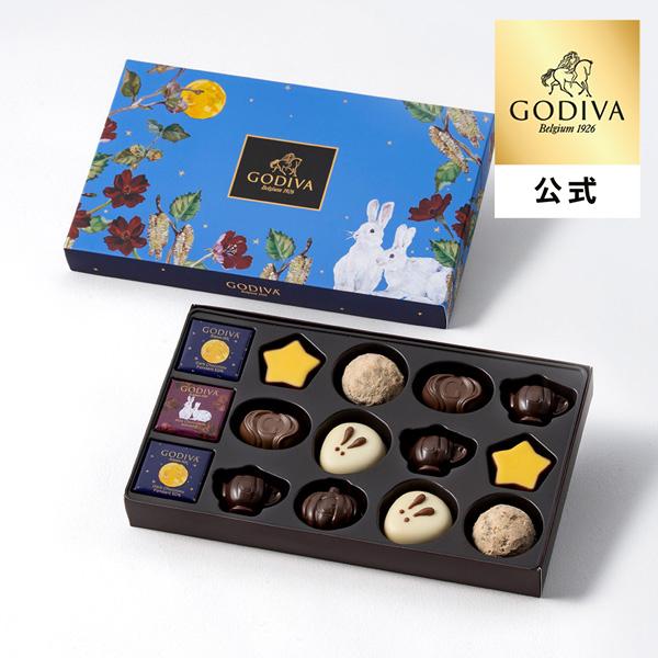 【発売日：2026年08月26日】お月見を連想させる白ウサギや満月をモチーフにした秋にぴったりな限定チョコレート粒やカレを詰め合わせました。 秋の夜にお月見をするウサギたち、チョコレートコスモスやヘーゼルナッツの木を描いたパッケージは、季節...