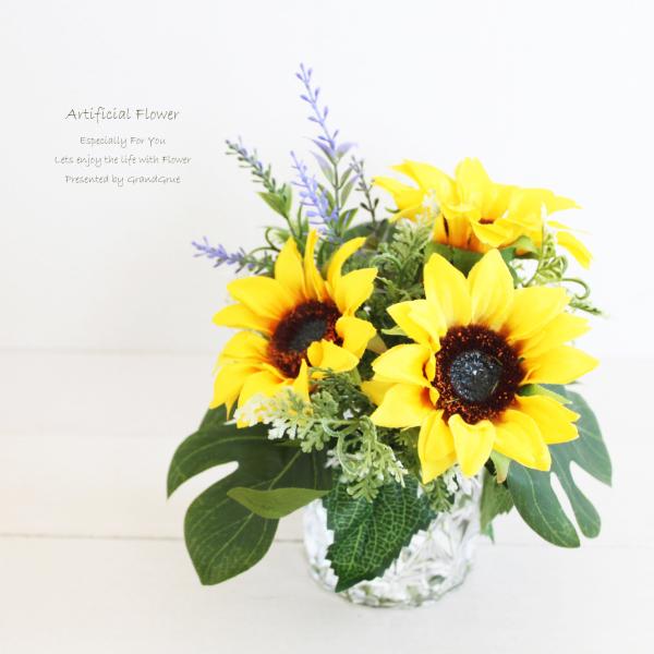 「送料無料」向日葵のマジカルウォーターアレンジメント本物のお水に見えるのはマジカルウォーター（人工水）。樹脂で出来ていて、固まっているの傾けてもでこぼれません。インテリアとしてお勧めです。【アレンジのサイズ】高さ約13cm（床からトップまで...