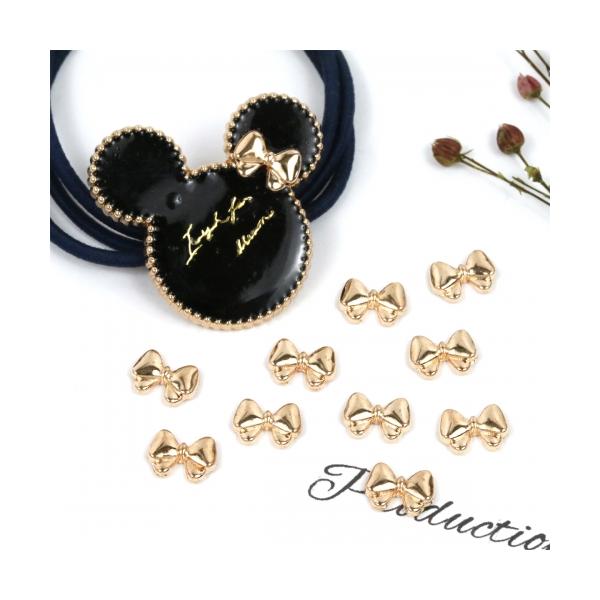 ネイルサイズの小さめのカン無しチャーム。作品のアクセントに重宝です^^○数量：10個○サイズ：約7×9mm○カラー：きれいめゴールド（表記のサイズは目安です。実際の寸法は個々に若干異なる場合がございます。）※生産ロットにより同じカラーでも色...