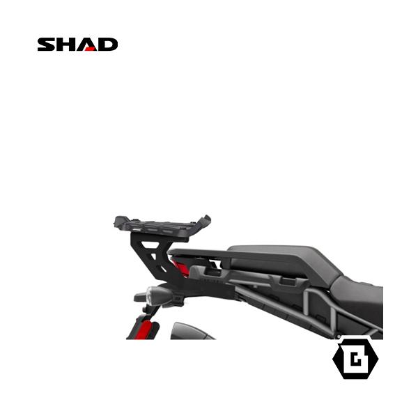 Fixings to mount a suitcase higher than the motorcycle.The SHAD Top Master fixing kit allows you to mount the top case t...