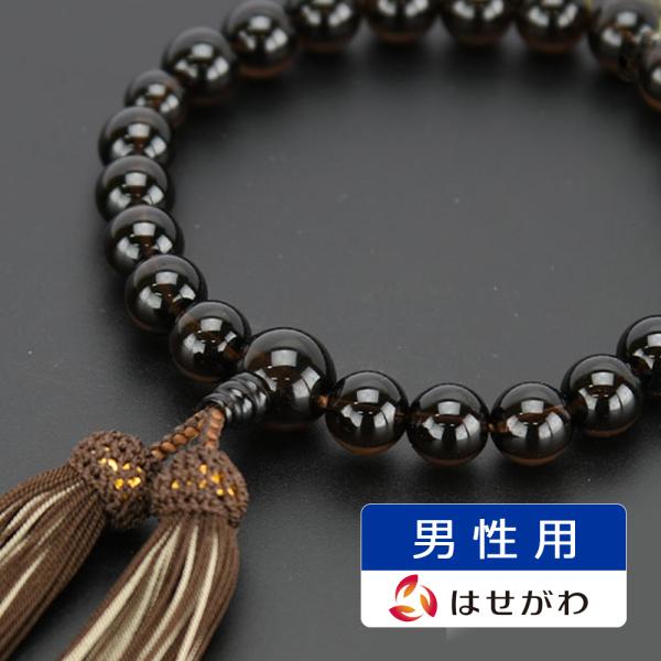 大地を思わせる深い色合いの茶水晶を使用したお数珠です。上品な玉を引き立てる2色の房を使用することで、彩り豊かな仕上がりです。京都で伝統的手法を用いて一つひとつ手作りしています。※天然石のため、色の濃淡や模様の違いがありますのでご了承ください...