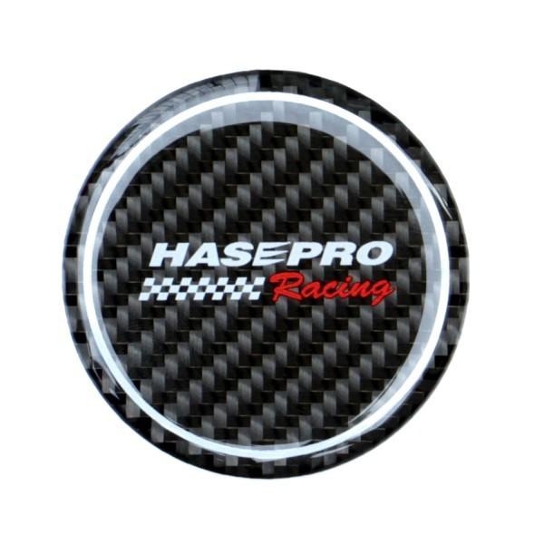 マジカルカーボンNEOサークルガーニッシュは、マジカルカーボンに高耐候ウレタン樹脂でトップコートを施し、本カーボンならではの奥行きと立体感を実現した円形のエンブレムになります。直径約50?の円形にHASEPRO Racingロゴ入り（ホワイ...