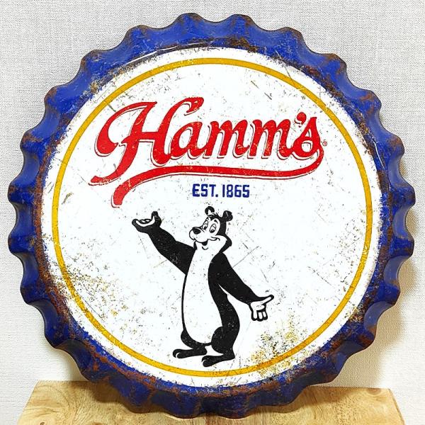「ボトルキャップ メタルサイン ”Hamm’s Bear Weathered”」アメリカのビール醸造会社、ハムズビールのボトルキャップ型のレトロでおしゃれなブリキ看板です！マスコットキャラクターのハムズベアが愛らしいデザインです。表面のビン...