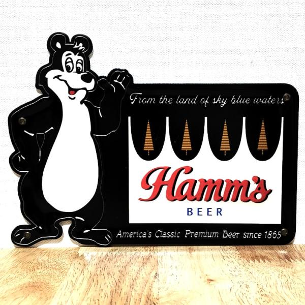 「ミニエンボスメタルサイン BEAR」アメリカのビール醸造会社、ハムズビールのマスコットキャラクターがデザインされたかわいいブリキ看板です！エンボス加工により、立体的に見えるおしゃれな仕上がり。小さくて軽量なので場所を選ばず飾ることができま...