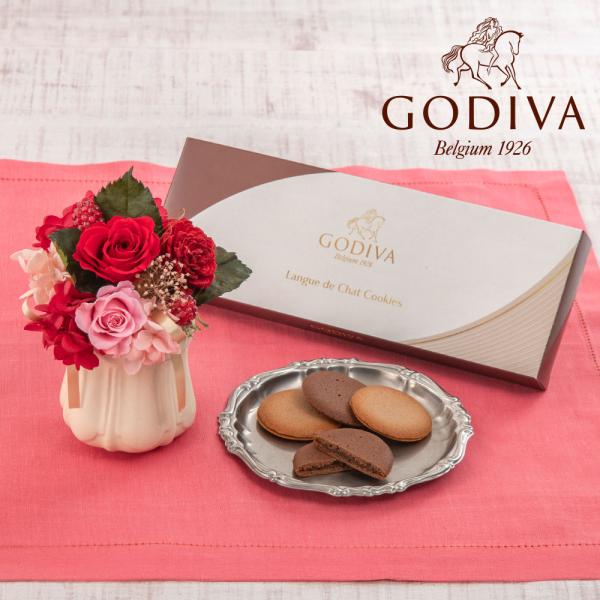 ■お届け 3日後以降でご指定可■注文締切2026/03/28　14:00までベルギーの高級チョコレートブランド「GODIVA」のクッキーとプリザーブドフラワーのセット。存在感のあるプリザーブドアレンジメントは、優しく、上品なピンクグラデーシ...