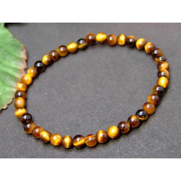 ※画像と同品質のものをお送りします。オリジナルアクセサリー作りに是非どうぞ〜〜（m−m）ポーチに入れた状態で発送いたしますので、そのままプレゼントとしてご利用頂けます。素材天然石：タイガーアイサイズ約：重さg　玉径4mm・±0.5mm　（ゴ...