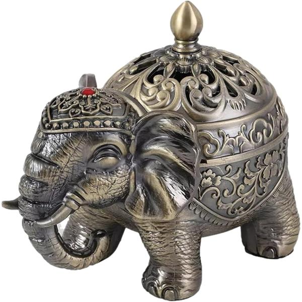 ・オリエンタルかつアンティークな趣のある象型の香炉です。亜鉛合金製で重厚感があります。「青古」調で色調も落ち着きがあり、手彫りの工芸品の様な風合いで空間と自然に調和するデザインです。イオンプレーティング加工で耐久性に優れており、エッジは滑ら...
