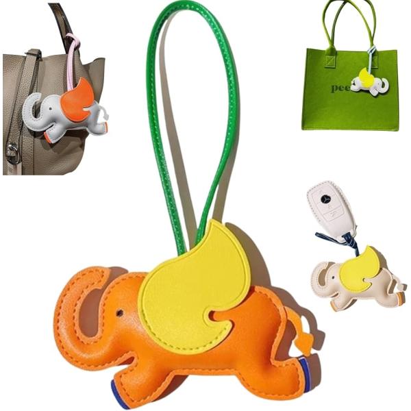 バリエーションコード : 2B9KJ6OPDK「エレガントなデザイン」象モチーフのバッグチャームは、オレンジとイエローの鮮やかな色合いで、どんなバッグにも華やかさをプラスします。旅行や日常のコーディネートにアクセントを加え、あなたのスタイル...