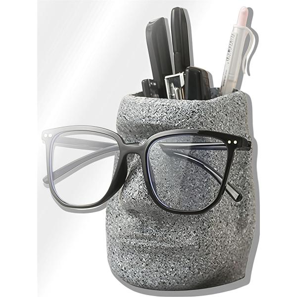 バリエーションコード : 2BURJ1SUKU「サイズ」：奥行き10cmx横9cmx高さ12cm 「重さ」：約550g 「材質」：合成樹脂(生産国：中国) 「機能・用途」：メガネスタンド、眼鏡置き、ペンスタンド、ペン立て「ユニークなデザイン...