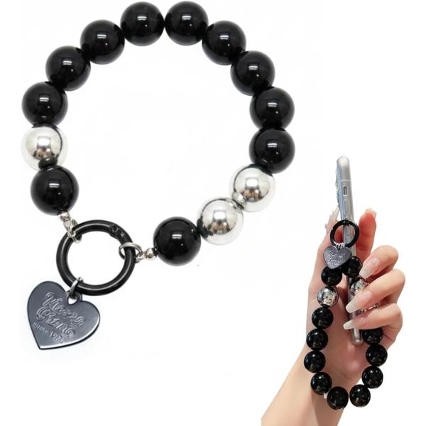 「機能」手首にしっかり通してスマホを固定でき、外出中の落下防止に役立つハンドストラップ仕様。写真撮影や移動が多い方にも最適です。「素材」艶のあるブラックビーズとシルバービーズ、アクセントのハートチャームを使用。高見えと大人可愛い印象を両立し...