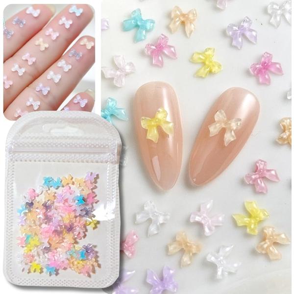 「超ミニサイズで可愛さ抜群」6x6x1mmの立体ミニリボンネイルパーツ。小さいのに存在感があり、指先に愛らしいアクセントをプラス。「7色100個セット」グレー、ピンク、淡ピンク、オレンジ、アクア、パープル、ホワイトの100個入りで、たっぷり...