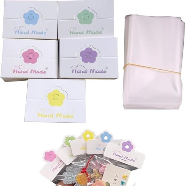 「サイズ」カードヘッダー：5x6.2cm、OPP袋：10 x 7cm「セット内容」OPP袋約100個セット+カードヘッダー100個セット 、大量の作品を効率的にラッピング・展示するのに最適です。「優しいデザイン」台紙とOPP袋のセットは、手...