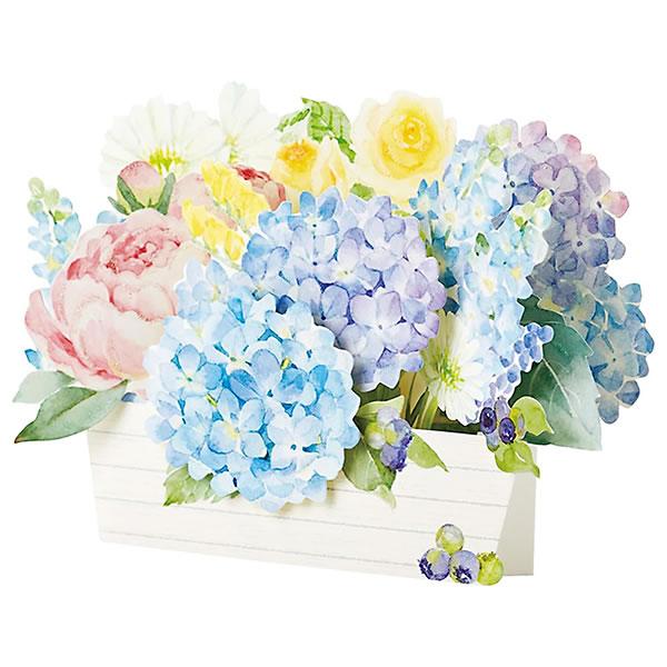 アジサイやシャクヤク、デルフィニウムなど、初夏に見頃を迎える花を立体的に表現しました。ラメ加工が施されており、キラキラと魅力的な仕上がりになっています。こちらのカードは季節のお便りとしてはもちろん、立てて飾れるのでご自宅に飾って楽しんでもい...