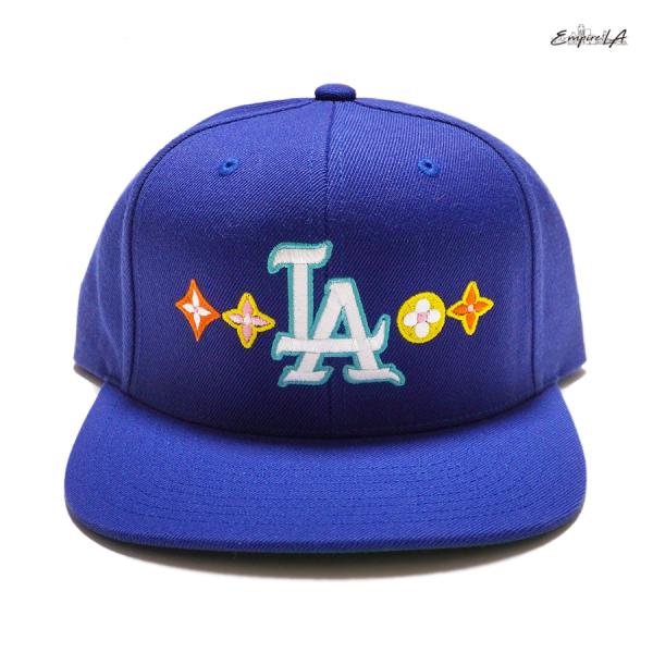 EMPIRE LAより人気のカスタムロゴスナップバックキャップが入荷！LAロゴとモノグラムロゴのバランスが絶妙なアイテムです。バックはアジャスターにて調整可能。