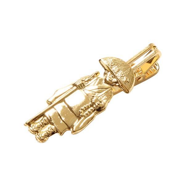 修行大師をデザインした、金色の輪袈裟止めです。輪袈裟がめくれたり首からずれないように、襟元で白衣と輪袈裟を止めるネクタイピンのようなものです。