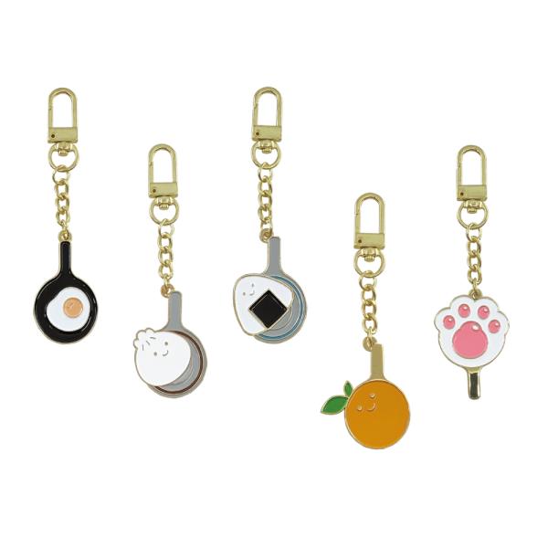 裏面にXIOMのロゴが入ったキュートなキーリング。全部で5種類のデザインあり。カラー：目玉焼き（XKH-1）　肉まん（XKH-2）　おにぎり（XKH-3）　みかん（XKH-4）　肉球（XKH-5）原産国：中国