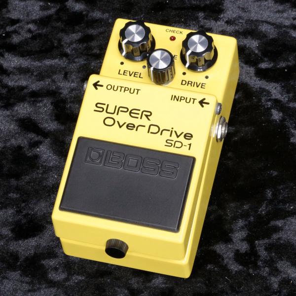 ボスの定番オーバードライブ!!BOSS SD-1 Super Over Drive は、クラシックなチューブアンプのような温かい歪みと自然なレスポンスを持つ定番オーバードライブです。中域に心地よい存在感を与えつつ、ピッキングの強弱にしっかり...
