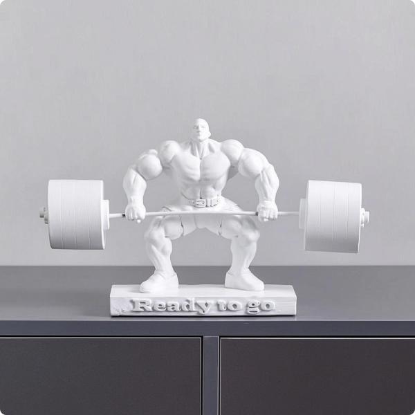 【製品概要】: 力強いリフティングポーズをとる筋肉質なボディビルダーフィギュアです。バーベルを頭上または肩の高さに掲げた圧巻的な存在感を放つデザインで、空間に力強いアクセントを加えます。【主な機能】: デスクや棚、受付、ジムのフロントなどに...