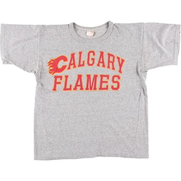 【コンディション】ランク：C【サイズ】着用感：メンズL表記サイズ：L着丈：57.5cm身幅：51cm肩幅：48cm袖丈：17cm【商品詳細】商品名：古着 RAVENS NHL CALGARY FLAMES カルガリーフレームズ プリントTシ...
