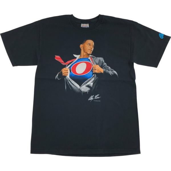 【コンディション】ランク：B【サイズ】着用感：メンズM表記サイズ：M着丈：65.5cm身幅：48cm肩幅：46cm袖丈：20cm【商品詳細】商品名：古着 00年代 ヘインズ Hanes HEAVYWEIGHT BARACK OBAMA バラ...