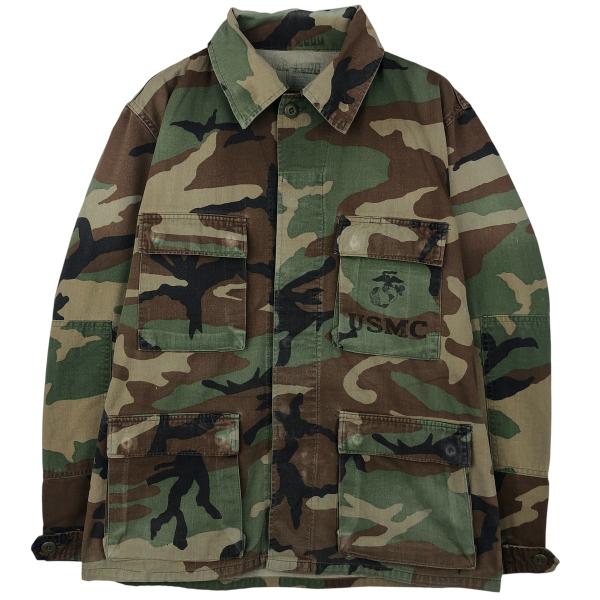 【コンディション】ランク：C【サイズ】着用感：メンズM表記サイズ：MEDIUM-REGULAR着丈：71.5cm身幅：57.5cm肩幅：46.5cm袖丈：61.5cm【商品詳細】商品名：古着 米軍 迷彩柄 ウッドランドカモ ステンシル入り ...