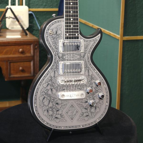 SPEC■Body Top: Duralumin■Body Back: Select African Mahogany■Neck: Select African Mahogany■Neck Joint: Set neck■Nut Width...