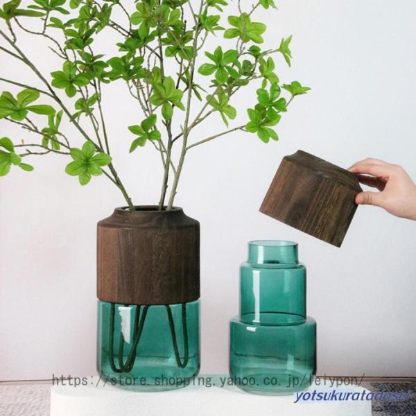 商品名: ガラス花瓶素材: ガラス、木サイズ：口径×高さ：小さい：8*22cm、大きい：8*27.5m（スタッフ採寸のため、若干の誤差が生じる場合がございます）場所: 窓辺、玄関、寝室、書斎などクリア独特なデザイン 北欧らしいシンプルなフラ...