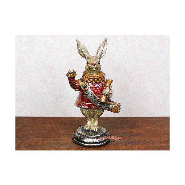絵本の中から飛び出してきたようなウサギの置物です。レトロなトランプ柄の衣をまとっています。写真の４種類を販売しています。サイズ（約）：高21cmｘ幅11cmｘ奥8cm／レジン製デザイン：ラビット・STAND商品毎に色合いや形状、汚し具合など...