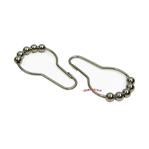 ローラータイプのカーテンクリップです。スムーズなカーテンの開閉が可能です。ステンレス素材です。サイズ（約）：幅3.8cmｘ高7cm／２個セット／輸入品ご覧の環境で多少色が異なります。写真のＭサイズ玉子や果物(フェイク)は大きさ確認用で付属し...