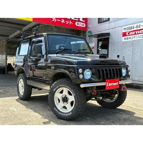 〈支払総額 表示車両CCC〉ランドベンチャー 4WD/スズキ/ジムニー/5速MT・リフトUP・社外マフラーH.9(1997)年/142,000km◆装備パワーステアリング/ETC/エアコン◆外装純正 16インチアルミ◆内装◆車歴携帯版、スマ...