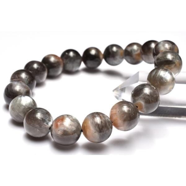 【材質】ブラックサンムーンストーン 11mm 産地：インド【サイズ】約11mm(±0.5mm)【腕周り】約16cm(伸縮性あり)【重さ】約34g【特徴・意味】全粒シラー入りで輝きが美しく見ているだけでもうっとりしてしまいそうです。ブラックカ...