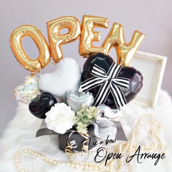 ストライプリボンの開店祝いバルーン電報の紹介・置き型で飾りやすいバルーンギフト・開店祝いに大人気の『OPEN』の文字バルーン付き！・ストライプリボンがお洒落な印象で、新店舗を素敵に引き立ててくれますよ。・造花を使用しているので水やりの手間な...