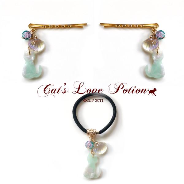 猫 ヘアアクセサリー べっ甲風 海色猫 シェル ヘアゴム（ポニー） ヘアピン Cat's Love Potion猫のヘアピンです。べっ甲風の海色の猫と涼し気なビーズとシェルが揺れます。モチーフが大きすぎないので派手にならずにさりげなくお使い...