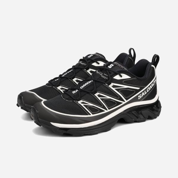 サロモンの象徴とも言えるXT-6は、トレイルの伝説的モデルたちの長い系譜を受け継ぎ、都会の風景にも完璧に適応しています。XT-6 EXPANSEは、このシリーズに新たな質感と深みをもたらします。贅沢で伝統的な素材をステッチパネルとステッチ入...