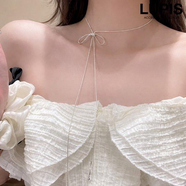 品番 : v3041サイズ : 全長約88cmモチーフサイズ : 横幅約5cm × 高さ約1.6cmその他 : モニター・撮影環境により実際の商品と色味が異なる場合があります。商品の説明シンプルなリボンモチーフが映えるネックレス。スネークチ...