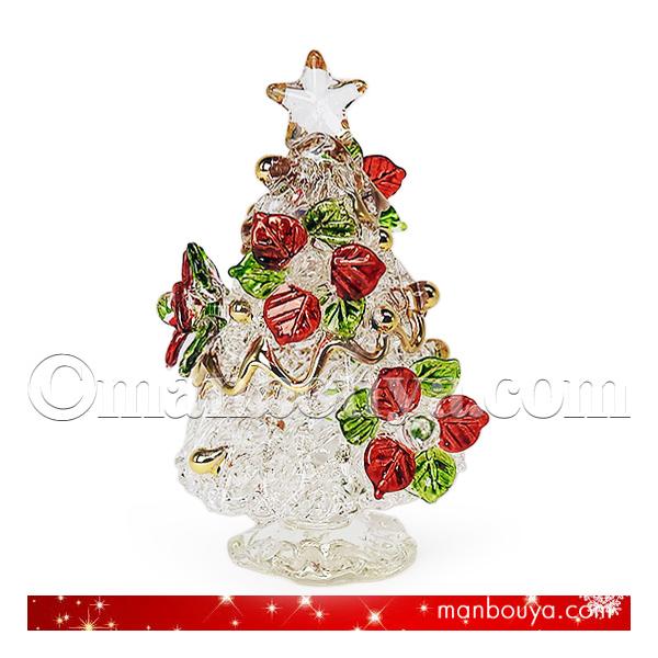 硝子製のクリスマスツリー。少し大きめで存在感があります。画像では解りづらいのですが、ツリーの透明部分は網目状になっていてキラキラ。ポインセチアも全てガラス製。ゴールドのラインがぐるっと巻かれ、華やかで綺麗です。お好きなガラス細工のディスプレ...