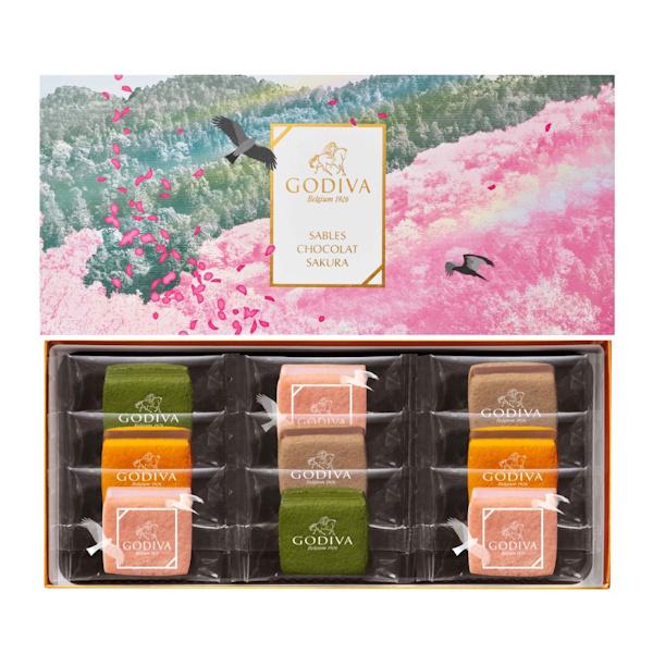 ■説明サクッと焼き上げたサブレでなめらかなチョコレートガナッシュをサンド。期間限定フレーバー「桜＆ホワイトチョコレート」と定番フレーバー3種を全体に桜をあしらった春を感じるパッケージに詰め合わせました。■商品詳細内容量：9個（桜＆ホワイトチ...