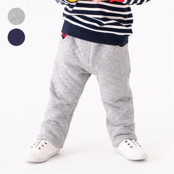 秋冬らしい中綿入りのキルティング、キルト素材の暖かみのある長パンツ、長ズボン。 前のポケット口、後ろのポケットのチェック柄の配色デザインが可愛い！ 裾を折り返すとチェック柄が出てくるのもポイント！ 裾は伸ばしたままでも折り返しても可愛く着ら...