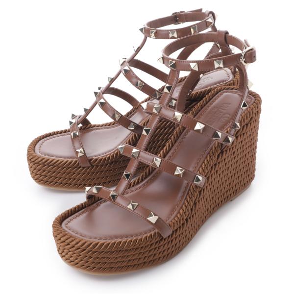 ヴァレンティノガラヴァーニ / VALENTINO GARAVANI / サンダル / ウェッジサンダル【2026年春夏新作】モデル：ROCKSTUD ANKLE STRAP WEDGE SANDAL ラウンドトゥ 95MM ウェッジソール...