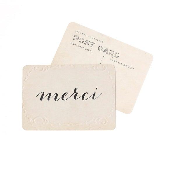 「Merci」ありがとう　 /　ポストカード人生の小さな瞬間が思い出の中で大きな瞬間になるように、愛する人にカードを贈りましょう。CINQMAIのポストカードは、剛性の高い300グラムの紙にプロ品質の印刷で作られています。国立美術学校を卒業...