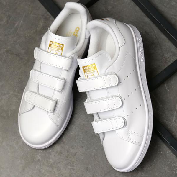 [ ブランド ] アディダス　adidas[ ジャンル ]スニーカー[ 素　 材 ]アッパー：天然皮革面ファスナーストラップが特徴的なスタンスミスコンフォート70年代初期に、テニスコート用シューズとして登場した「STAN SMITH」。その...