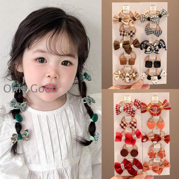 リボンやフラワーモチーフの可愛いデザイン?10本の子供用ヘアゴムセットです。【カラーについて】生産ロットにより柄の出方や色の濃淡が異なる場合がございます。お使いのモニターや撮影時の光の加減などにより画像と実際の商品のカラーが異なる場合もござ...