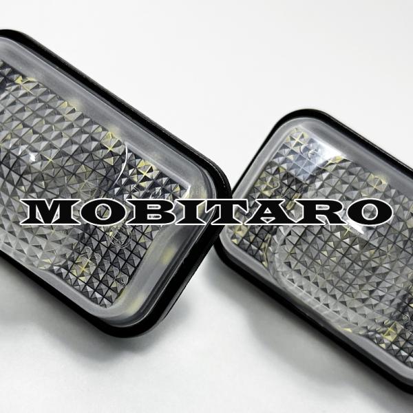 ダイハツ 専用設計 レンズユニット一体式 ナンバー灯（左右2個セット）SMD  ： 片側18発、左右合計36発カラー ： 6500K純白仕様純正品番「 81270-B2060 」互換品レンズ一体型タイプなので配光のバランスが良く、単純なバル...