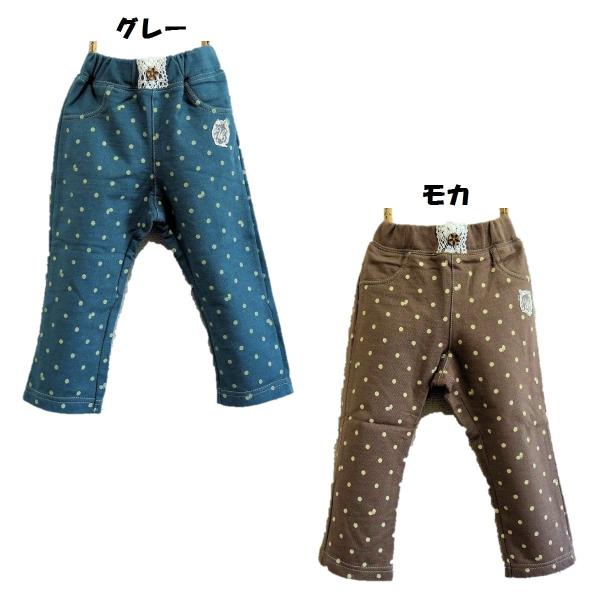 UZULAND（ウズランド）の水玉柄＆ちょうちょ柄ニットデニム裏毛長ズボンです。前ポケット2つはフェイク、後ろポケットは１つついています。水玉プリント柄のなかにひらひらちょうちょうが隠れています。ウエストボタンは花をモチーフにした木ボタン、...