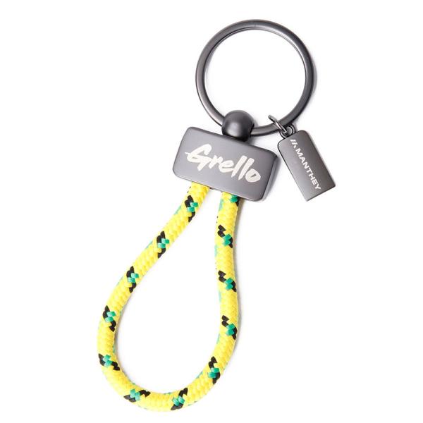 マンタイ レーシングのオフィシャルキーリング。Grelloのシンボルカラーに染まったロープキーチェーン。マンタイのロゴがプリントされたチャームが付属されています。