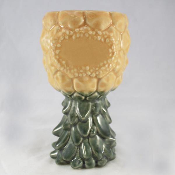“BOTTOM’S UP PINEAPPLE” GOBLETGlazed in hues of harvest gold (shades of orange and yellow) and jungle green, our “Bottom...